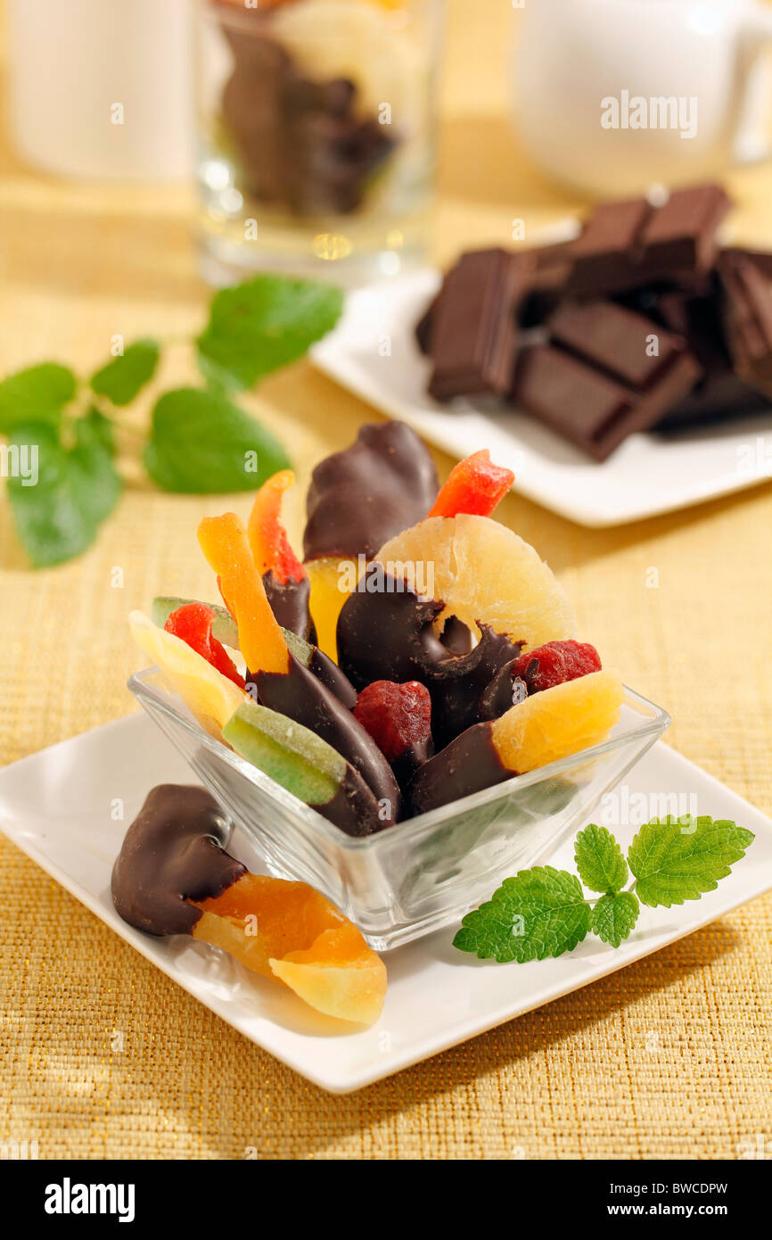 Candied fruits with chocolate. Recipe available Stock Photo - Alamy