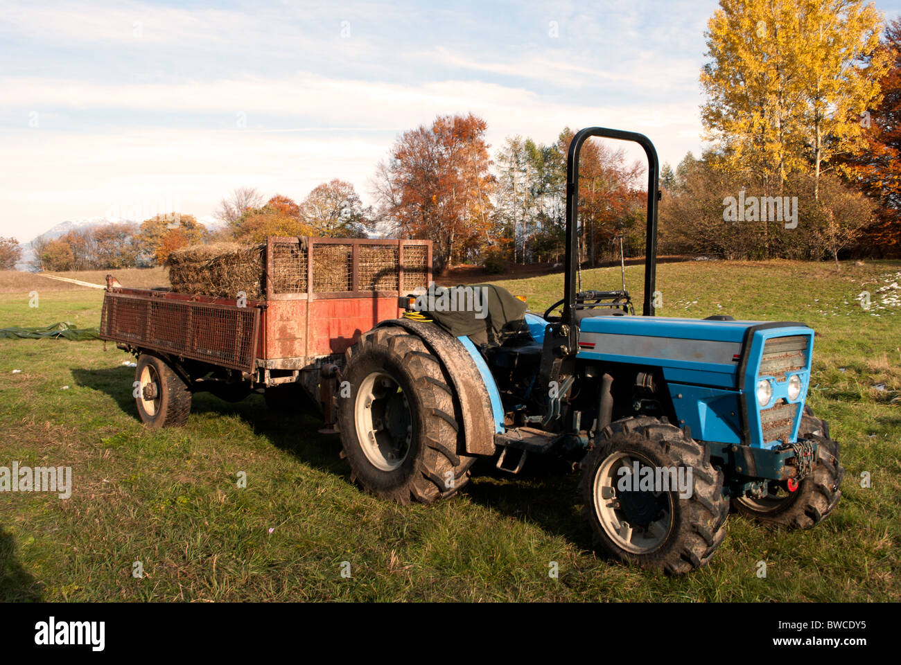 lawn tractor the load of hay Stock Photo - Alamy