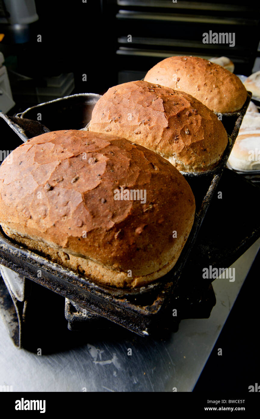 Traditional bakery rustic granary loaves in tin Stock Photo - Alamy