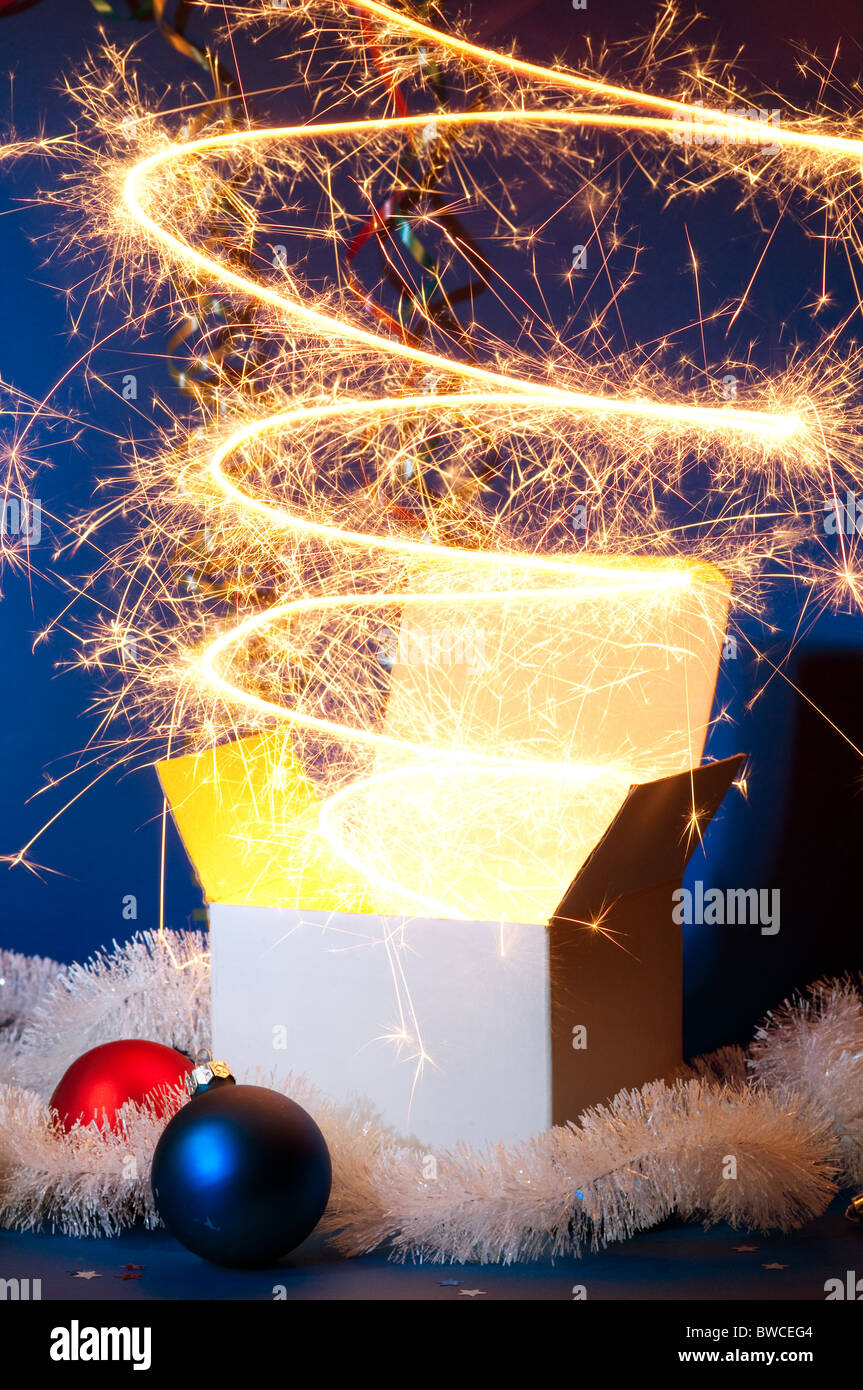 Opened cardboard box package with glowing light Stock Photo - Alamy