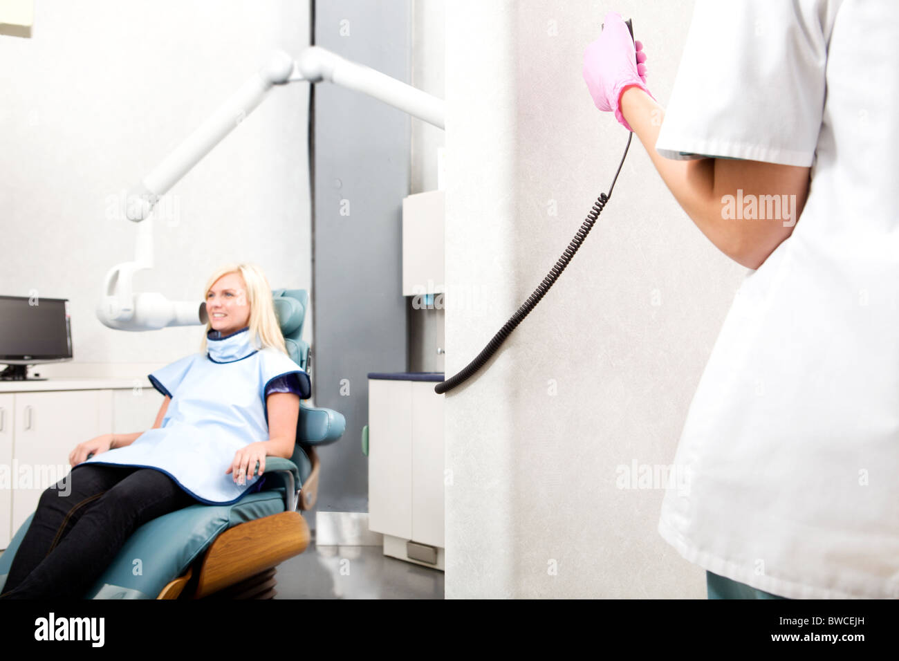 A dentist taking an x-ray of a patient Stock Photo - Alamy
