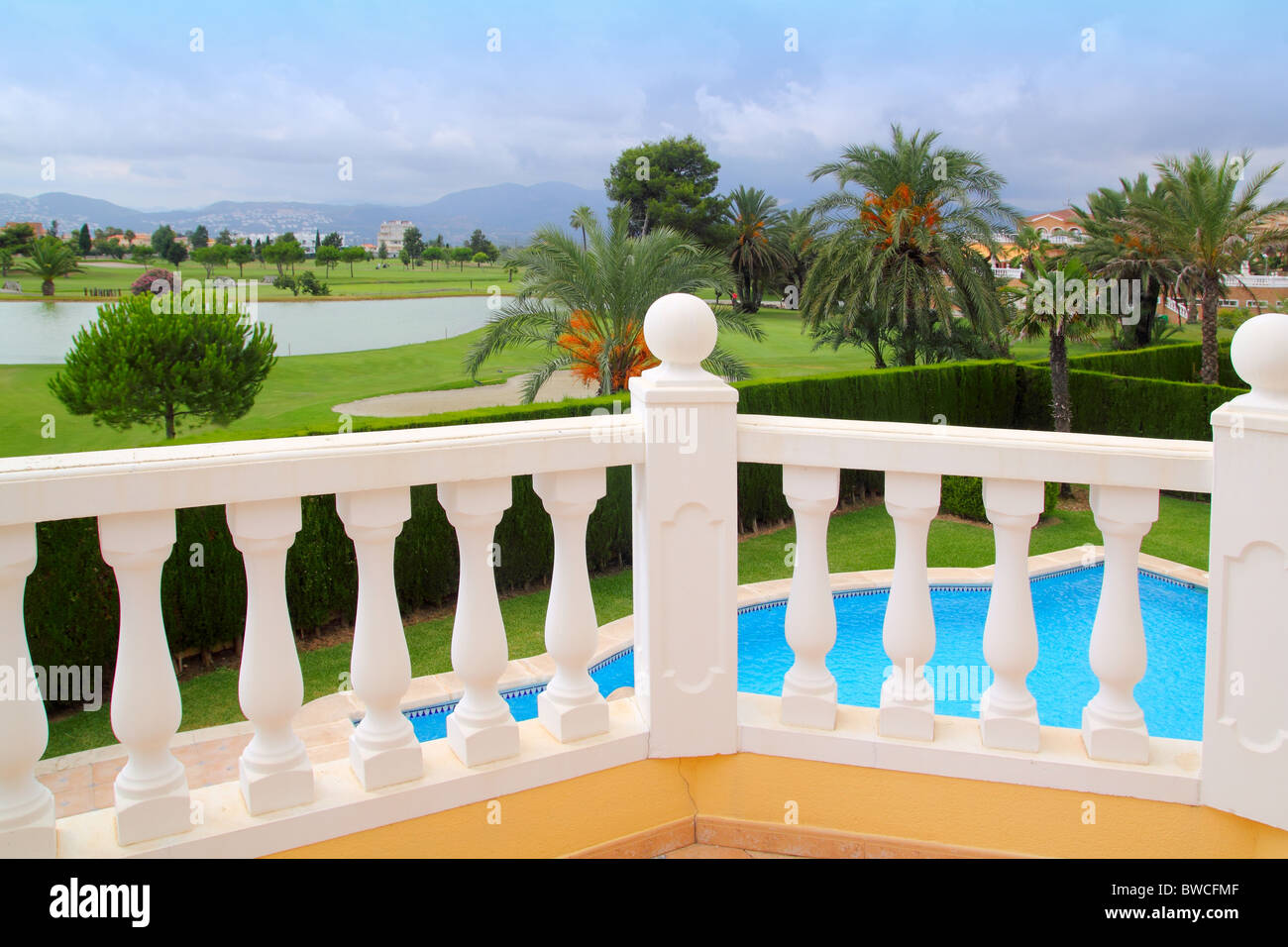 Golf course view from house with pool white balustrade Stock Photo - Alamy