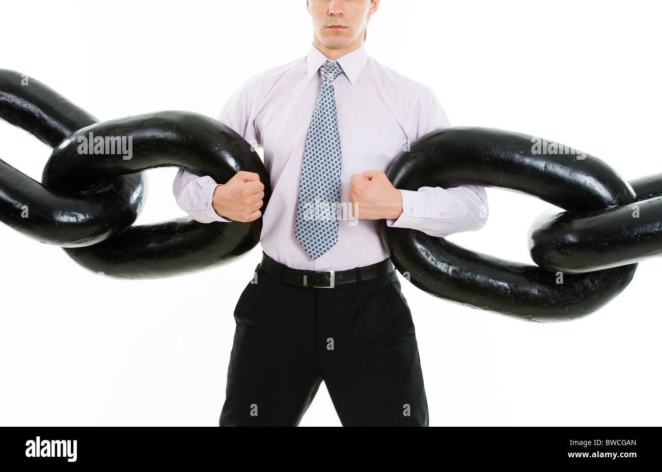Powerful businessman holding sections of huge chain over white ...