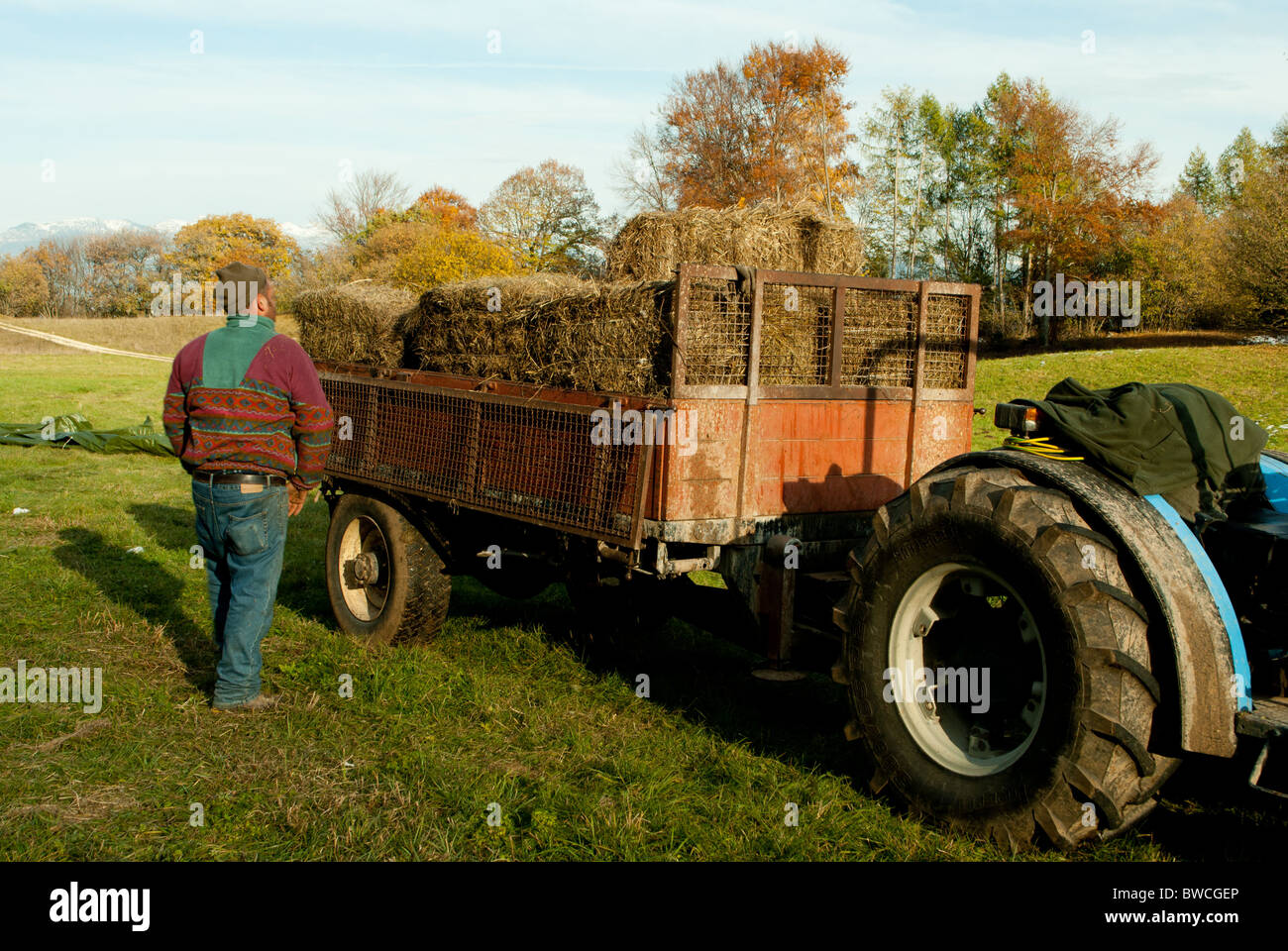 lawn tractor the load of hay Stock Photo - Alamy