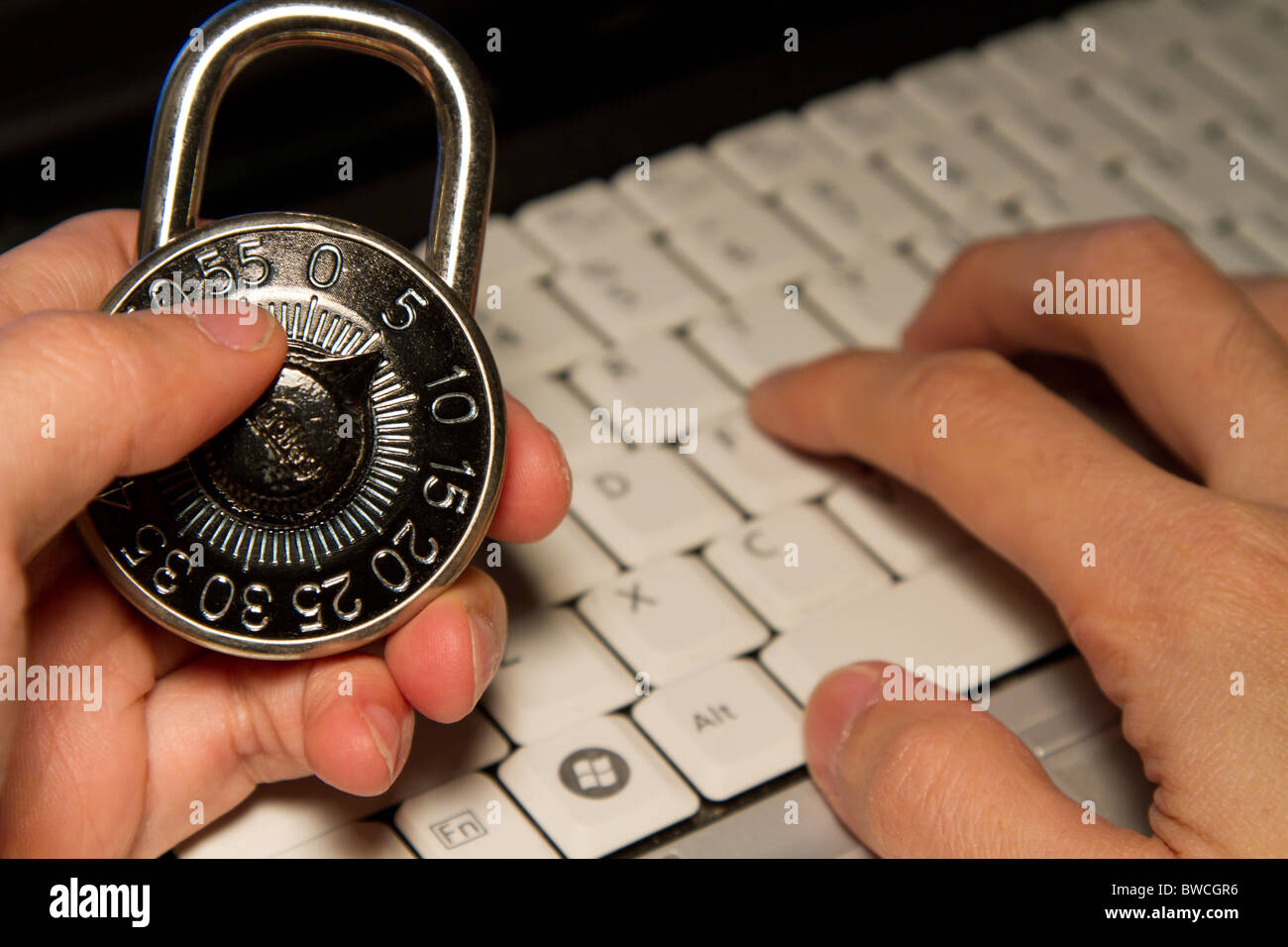 combination lock in front of a computer keyboard Stock Photo - Alamy