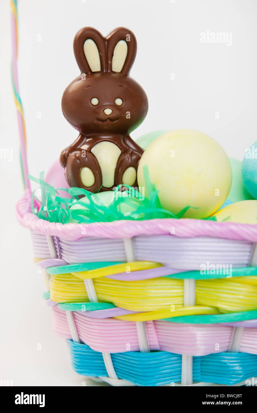 Studio shot of Easter eggs and chocolate bunny in basket Stock Photo ...