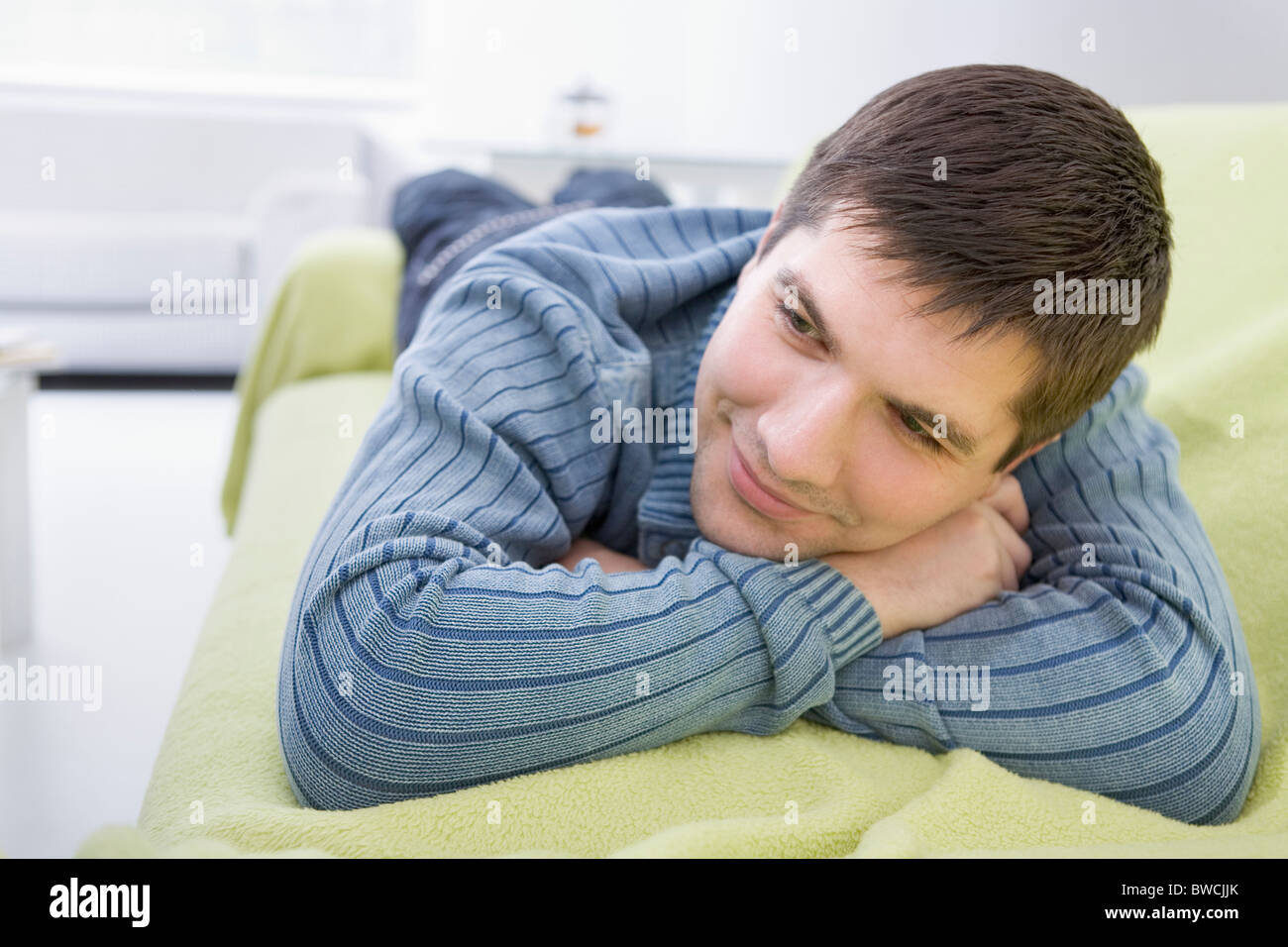 Young man resting arms hi-res stock photography and images - Alamy