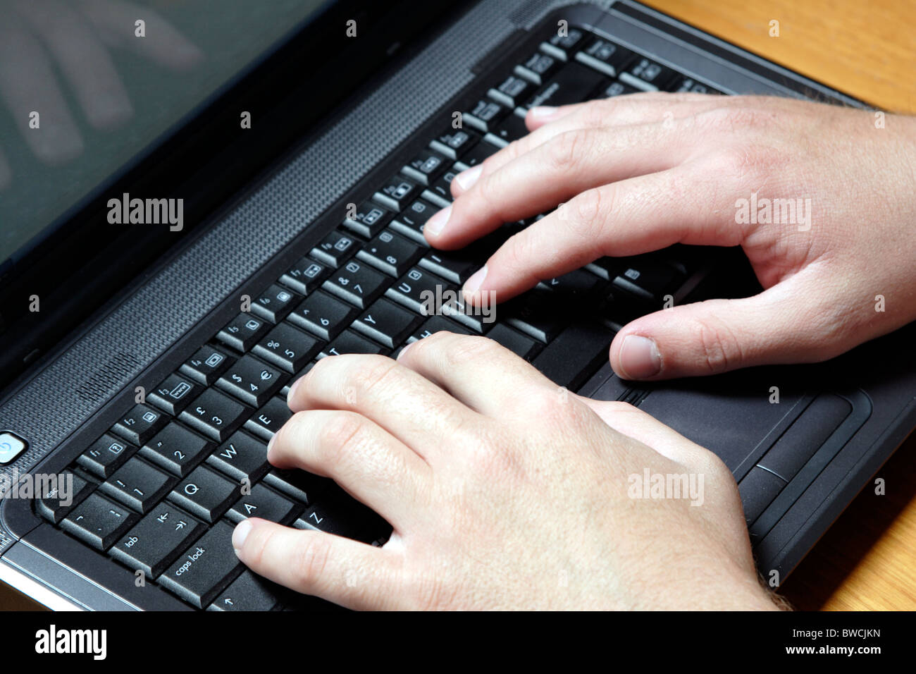 Person typing on laptop computer Stock Photo - Alamy