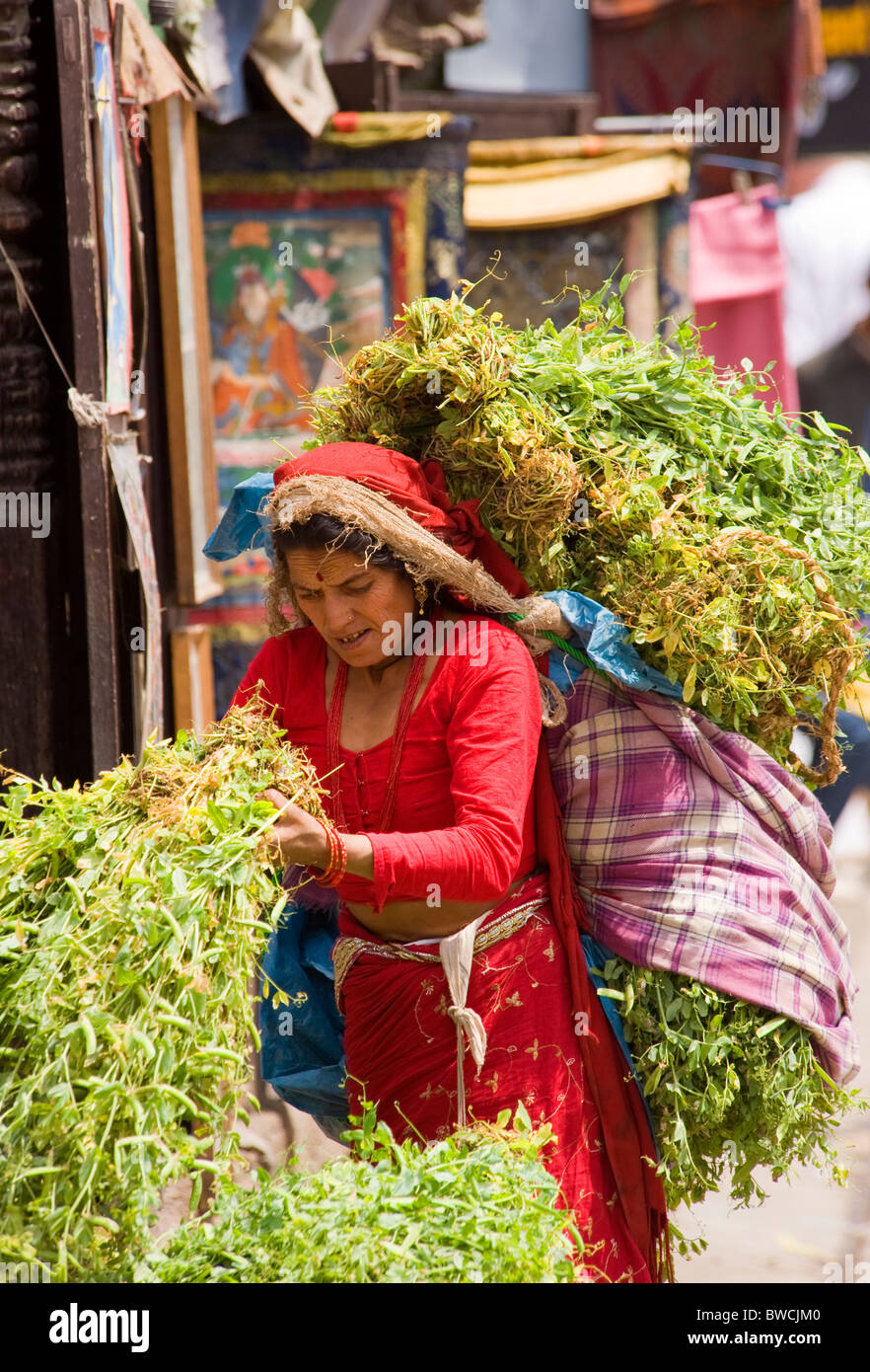 Lady carrying traditional food Stock Photo - Alamy