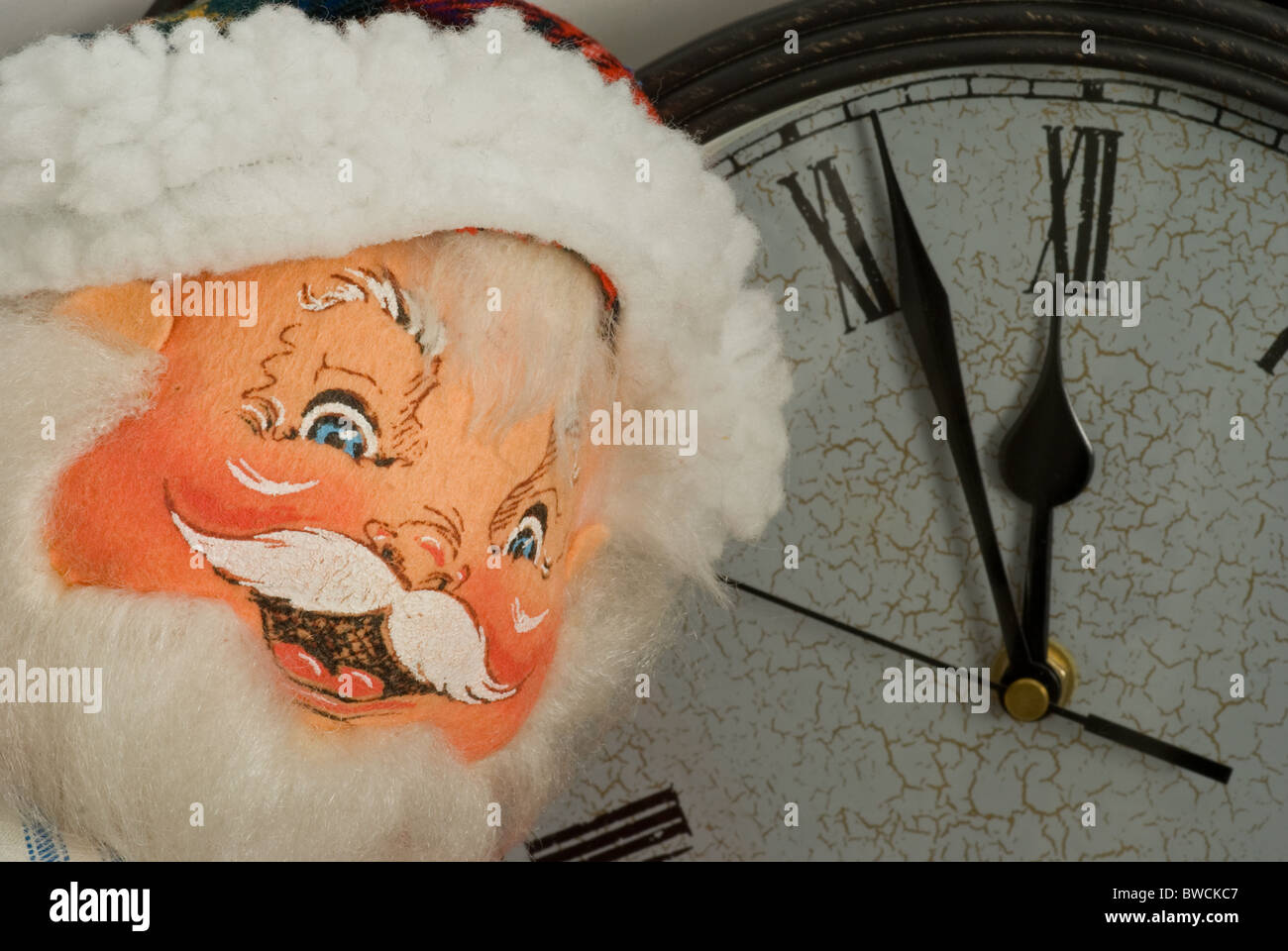 Santa Claus smiles with a large clock in background approaching ...