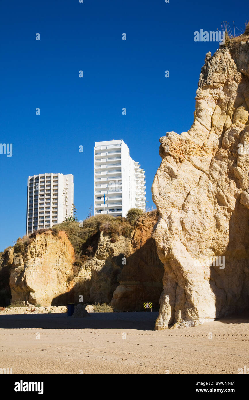 A view of the cliff rocks and hotels, from the beach in "Praia da Rocha ...