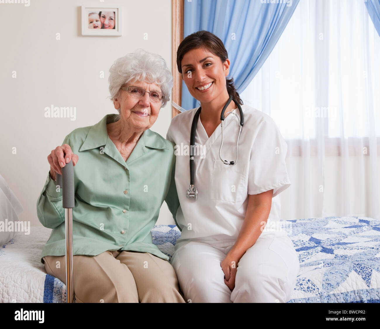 USA, Illinois, Metamora, Portrait of nurse and senior woman with cane ...