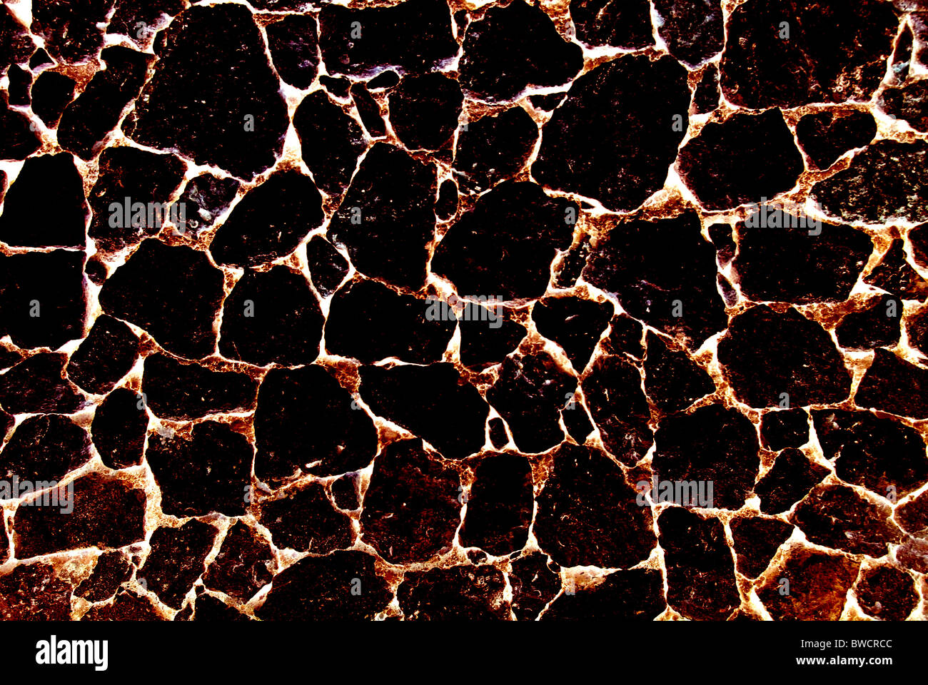 Burnt volcanic stone abstract textured background Stock Photo - Alamy