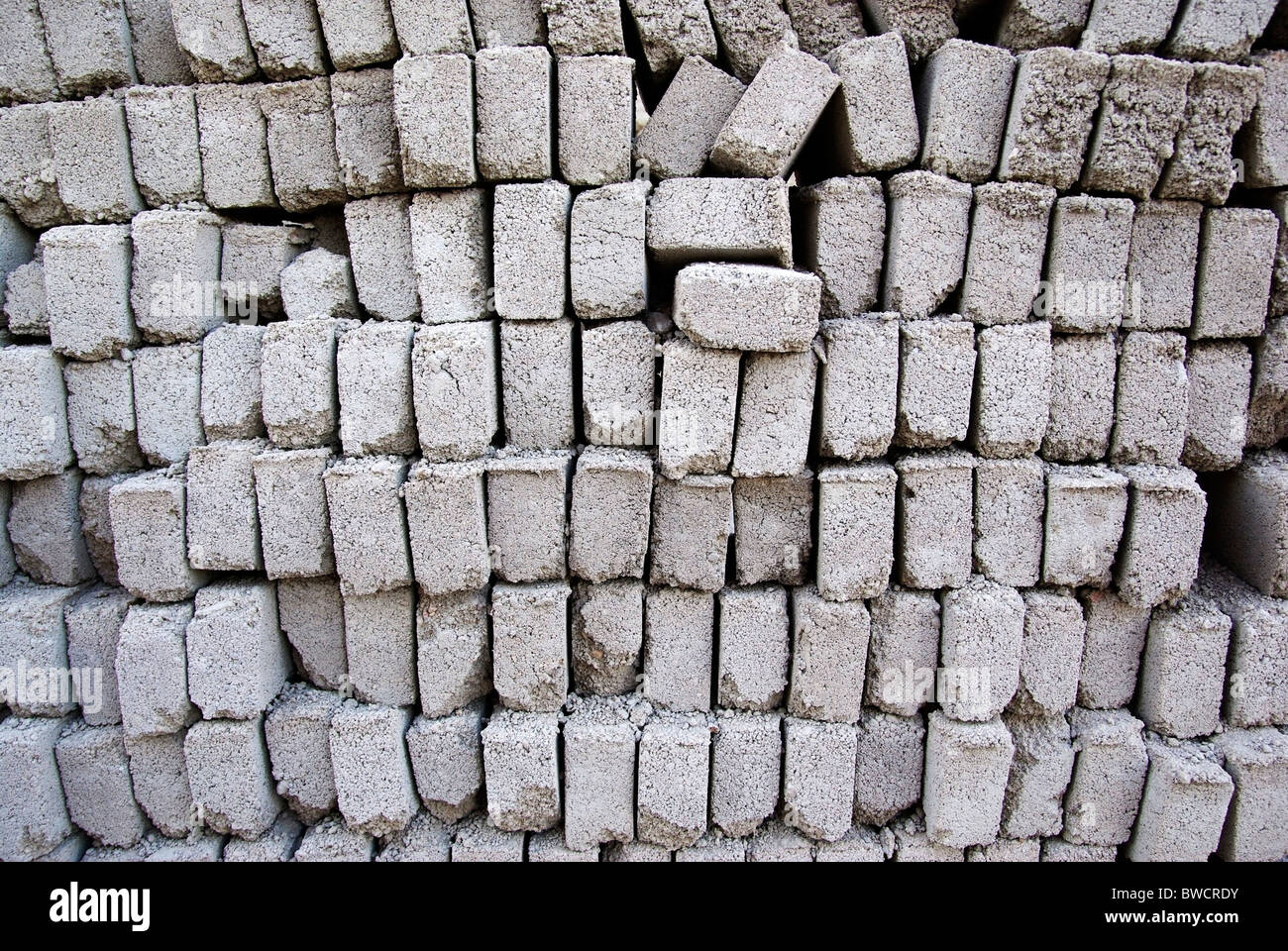 Stack of gray bricks. Abstract textured background Stock Photo - Alamy