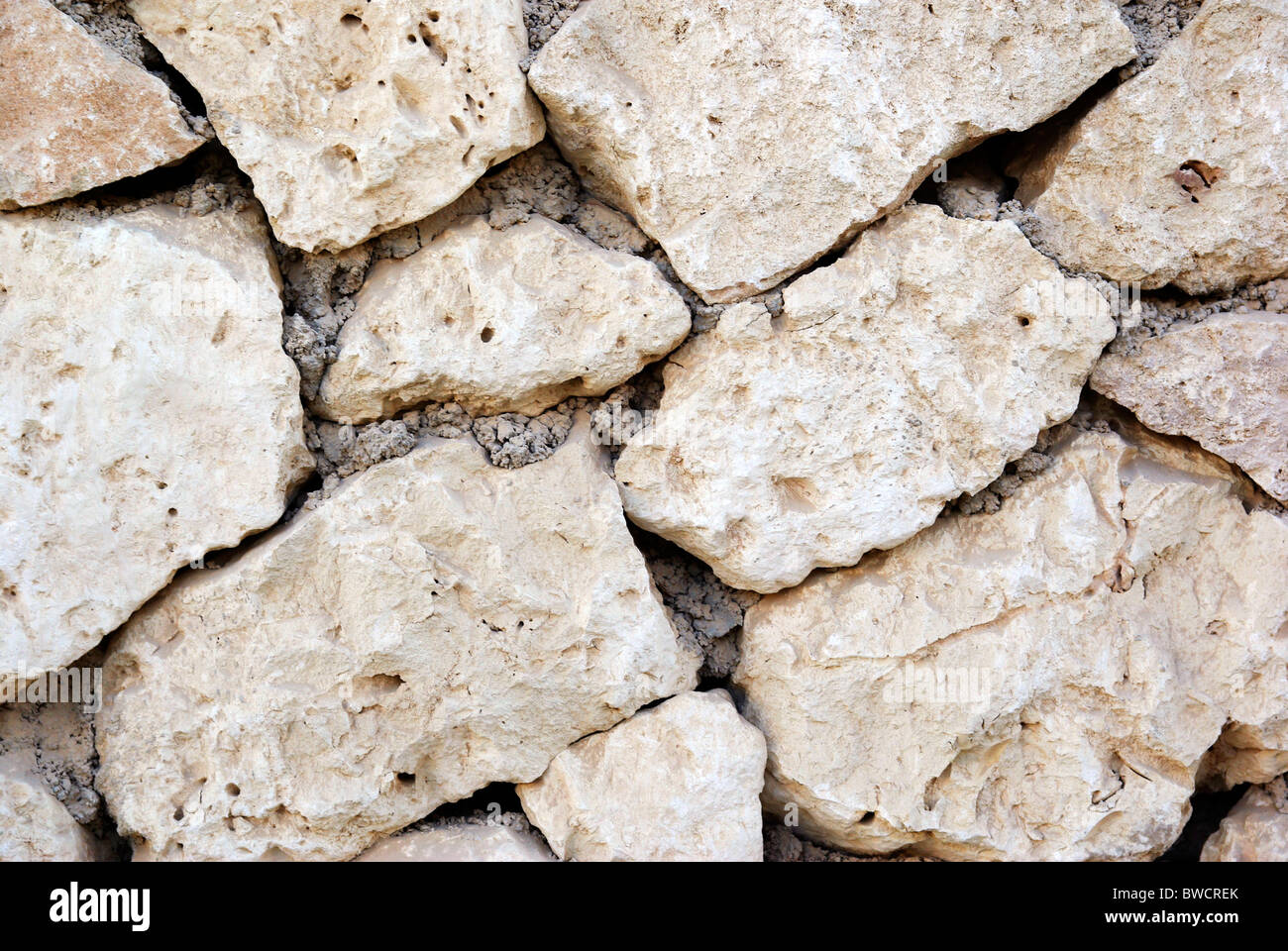 Close-up wall made of stone. Textured background Stock Photo - Alamy