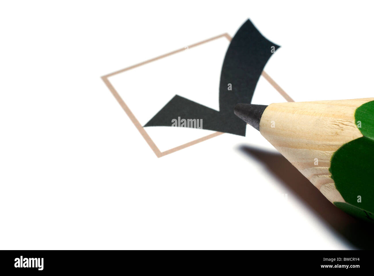 Checkbox with tick and big green pencil isolated on white background ...