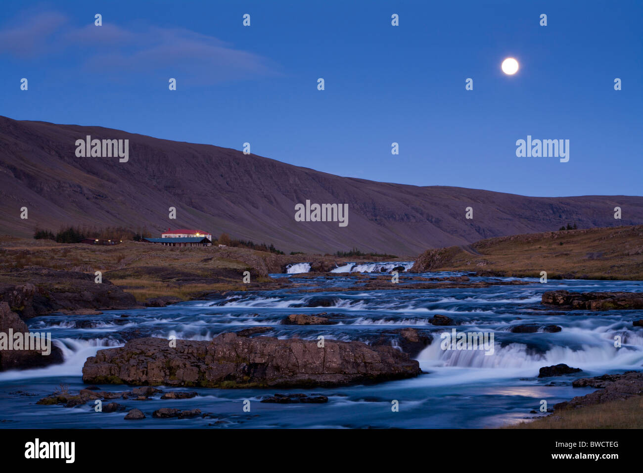 Moonrise over Laxa i Kjos, salmon fishing river. Hvalfjordur, Southwest ...