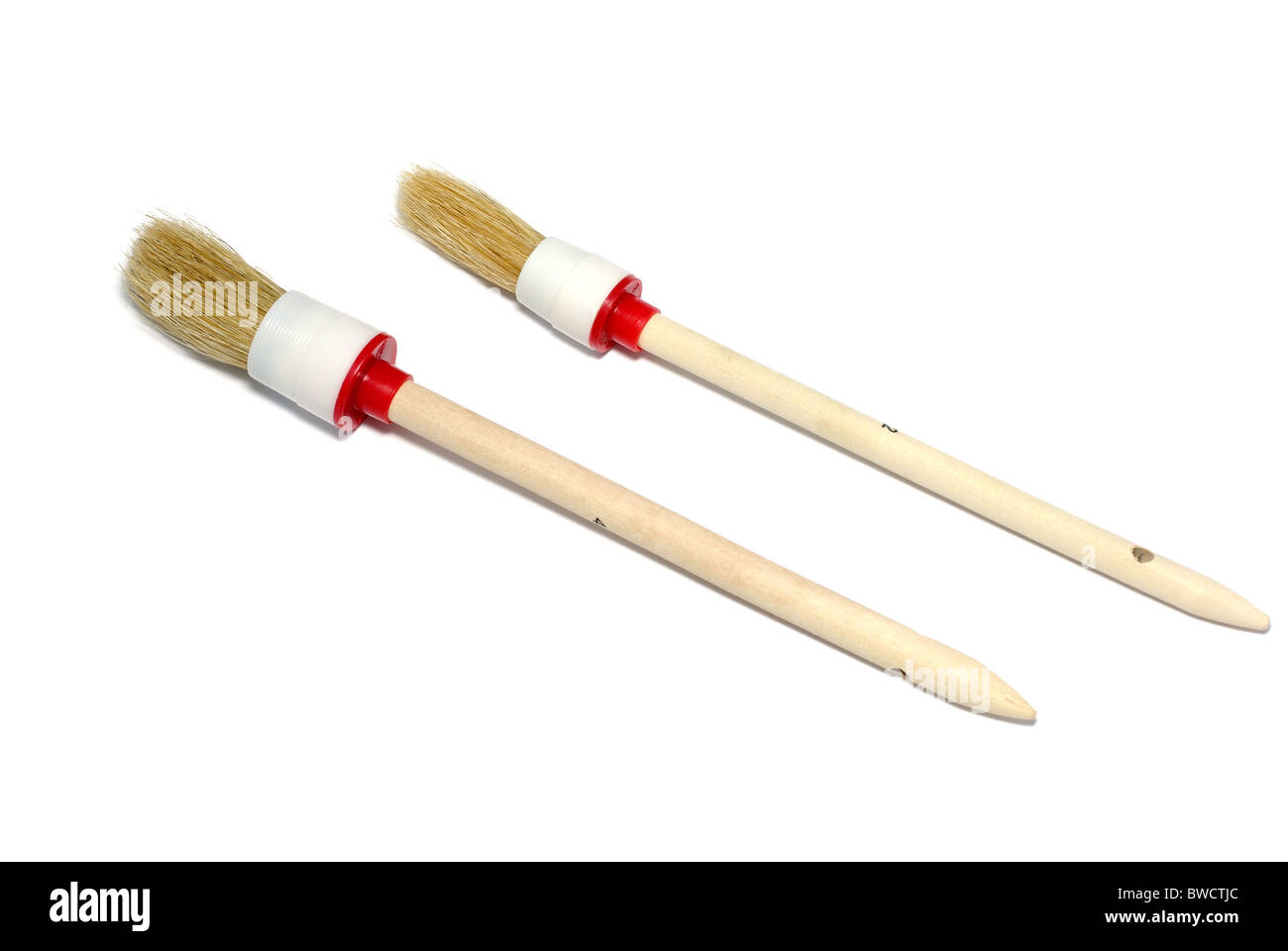 Two round brushes isolated on white background Stock Photo - Alamy