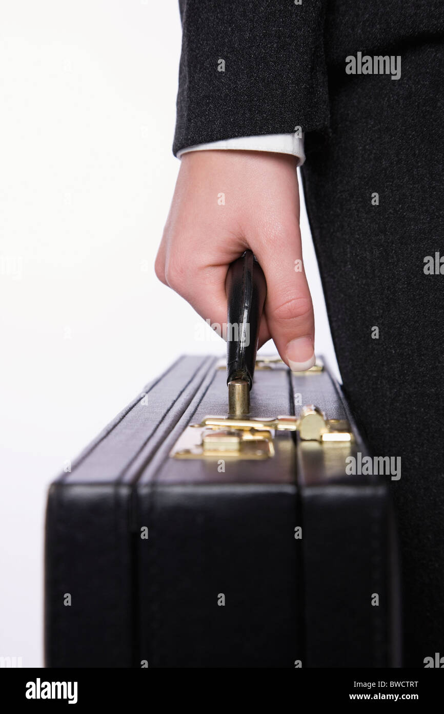 Hand holding briefcase hi-res stock photography and images - Alamy