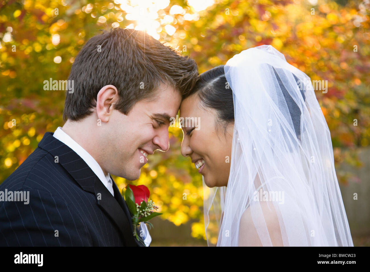USA, Illinois, Metamora, Bride and groom laughing Stock Photo - Alamy