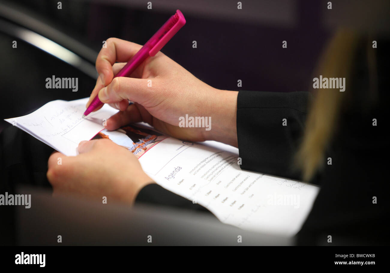 Woman note write pen seminar hi-res stock photography and images - Alamy