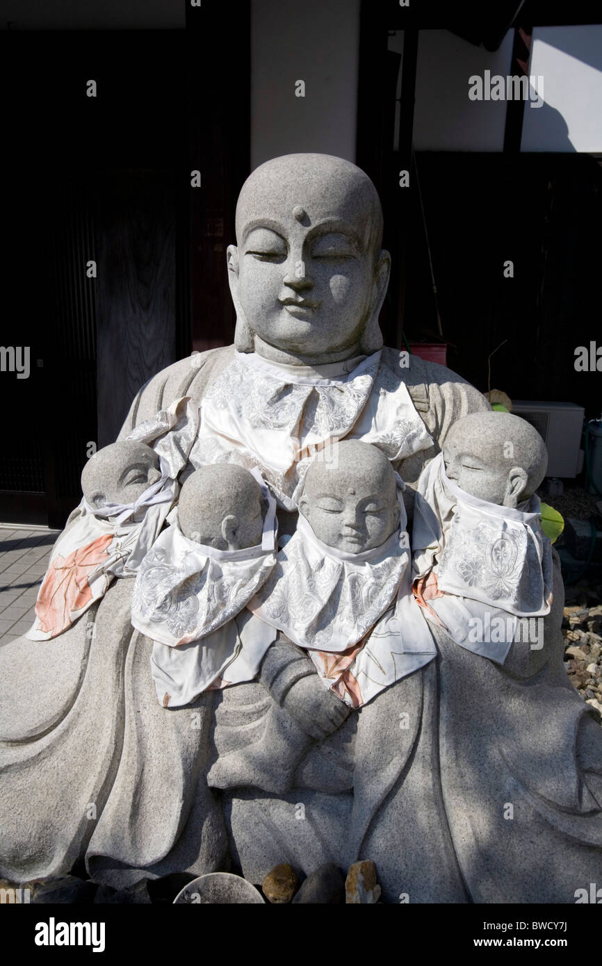 Statue of Buddha with children, Arashiyama Kyoto Japan Stock Photo - Alamy