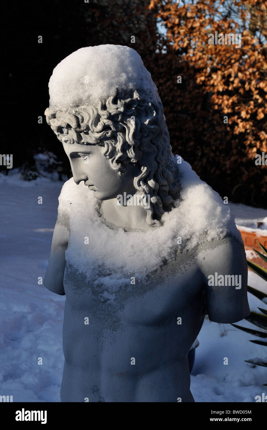 Garden statue freezes in English winter Stock Photo - Alamy