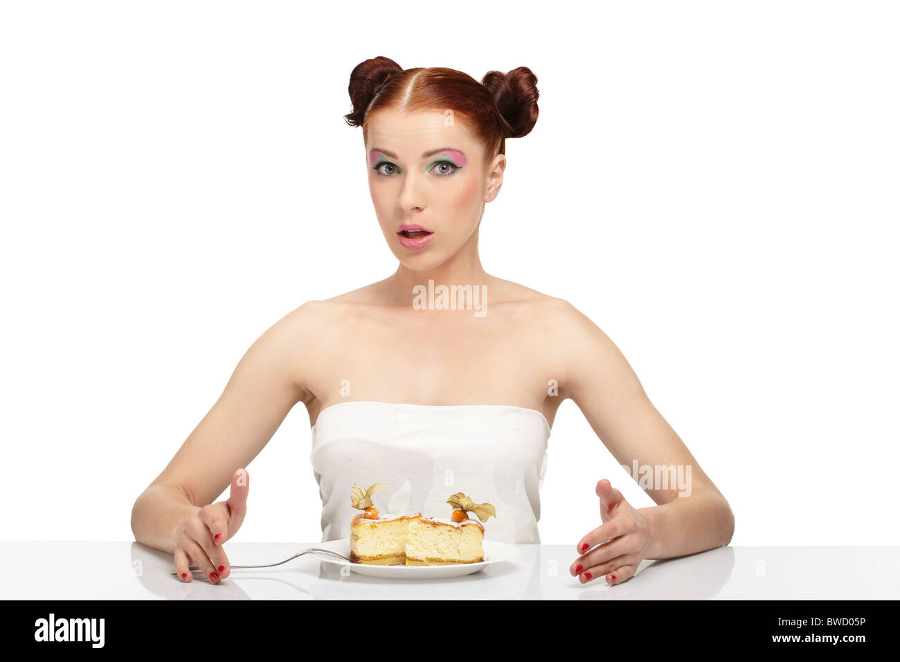 The beautiful young woman eat tasty cake Stock Photo - Alamy