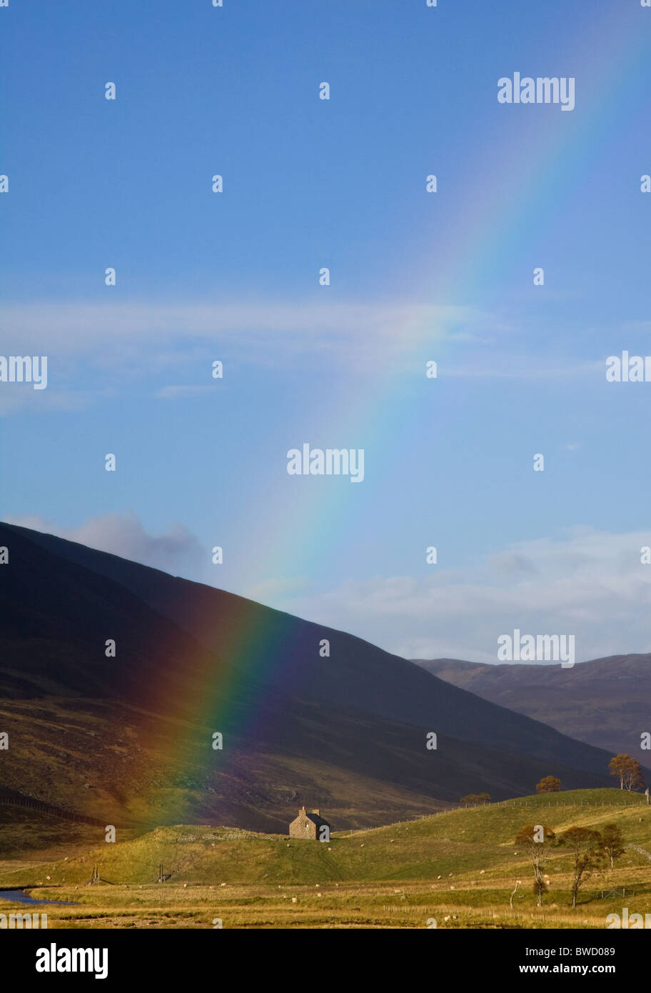 Rainbow over an old cottage Stock Photo - Alamy