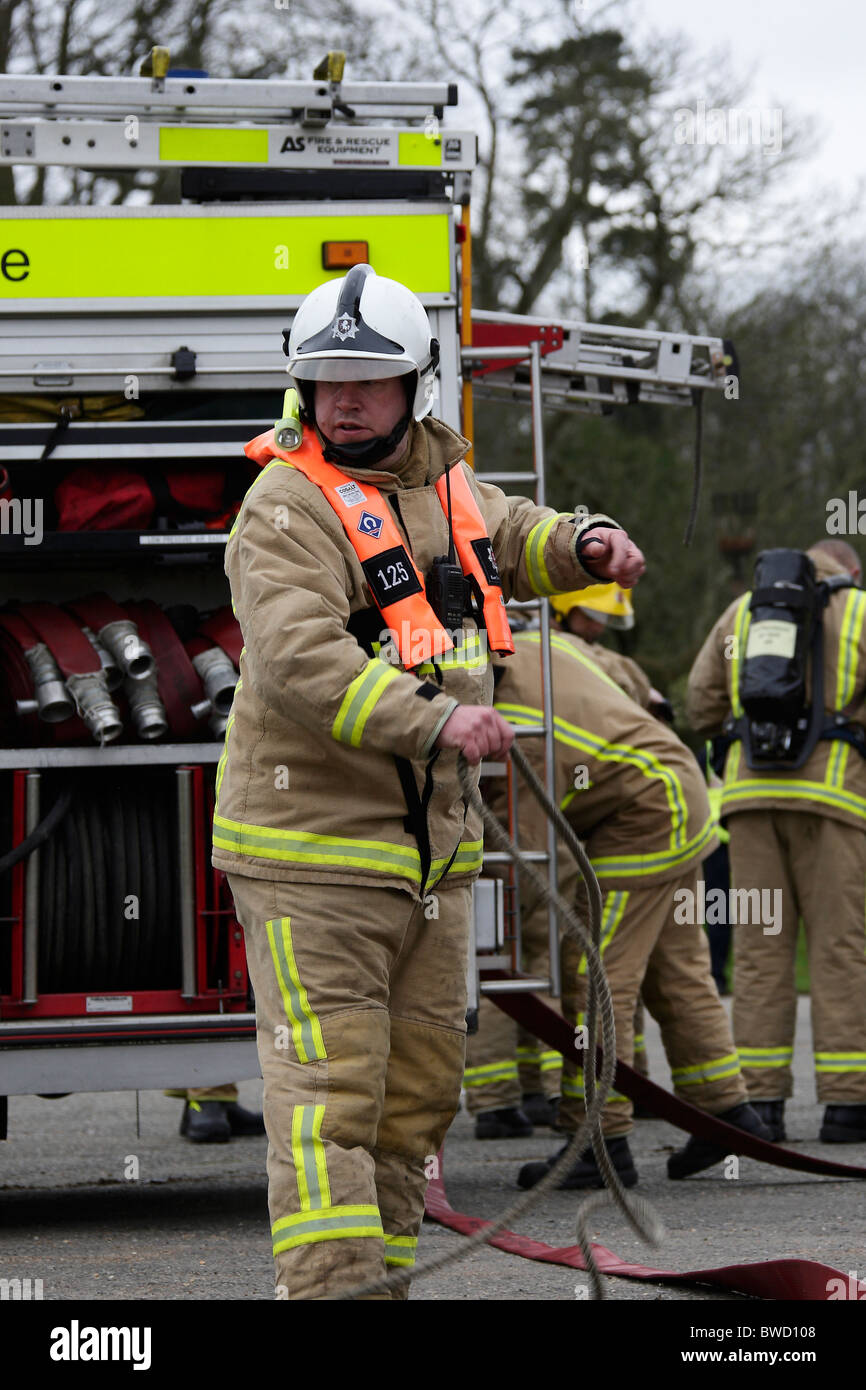 Fireman throwing a rope line Stock Photo - Alamy