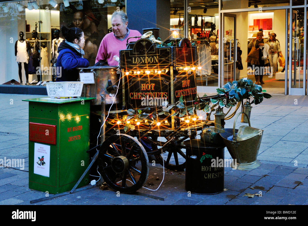mobile cart selling traditional roast chestnuts at night at a christmas ...