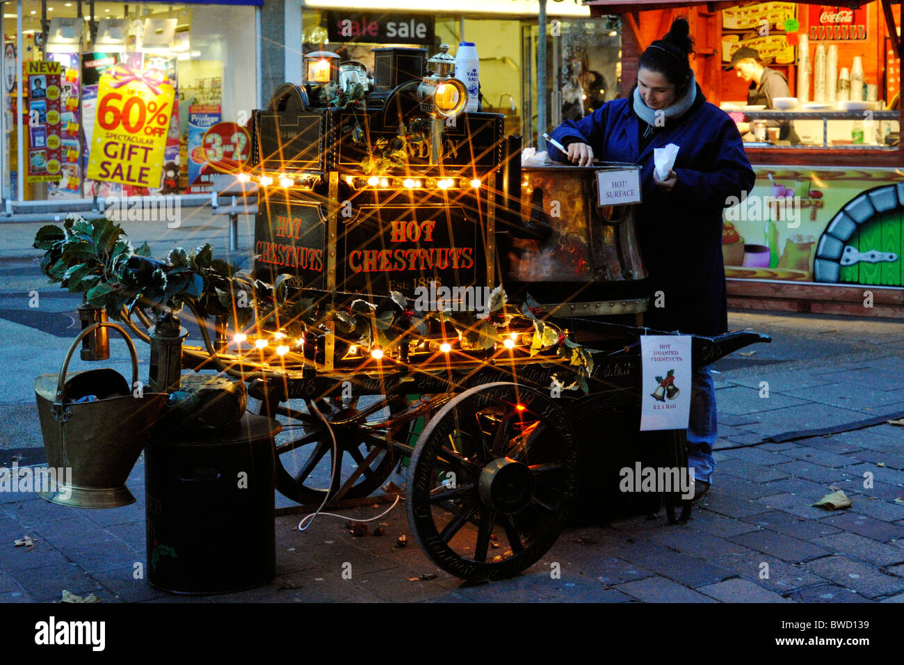 mobile cart selling traditional roast chestnuts at night at a christmas ...