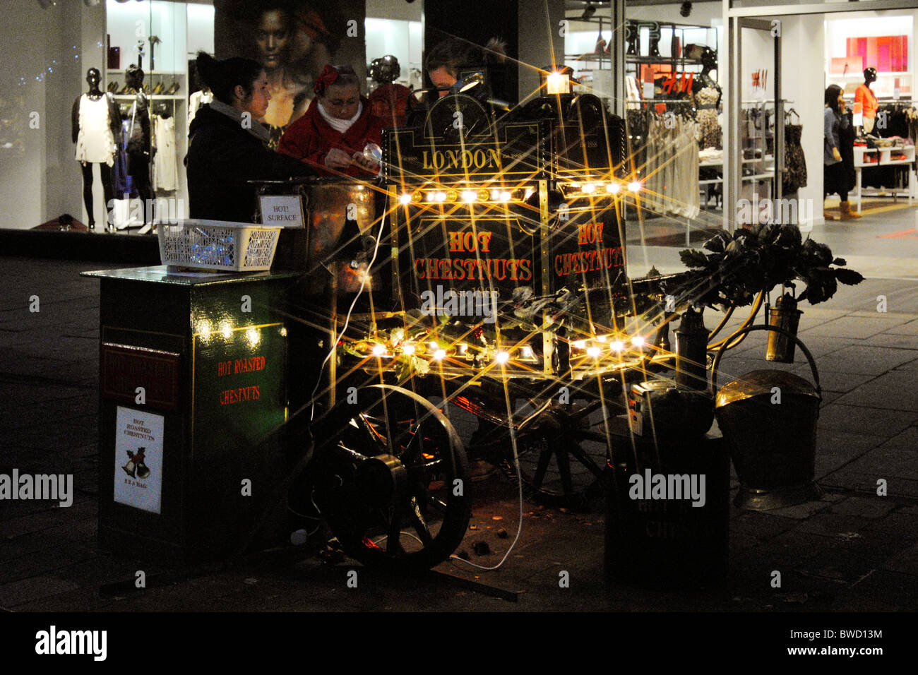 mobile cart selling traditional roast chestnuts at night at a christmas ...