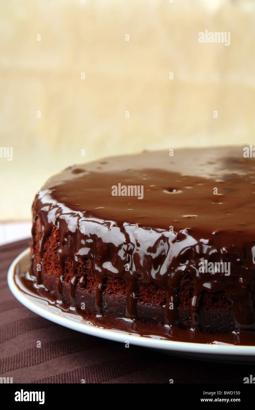 Big chocolate cake with chocolate frosting Stock Photo - Alamy