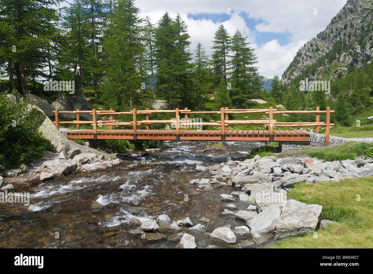 small bridge over an alpine creek in Arpy valley, Aosta, Italy Stock ...