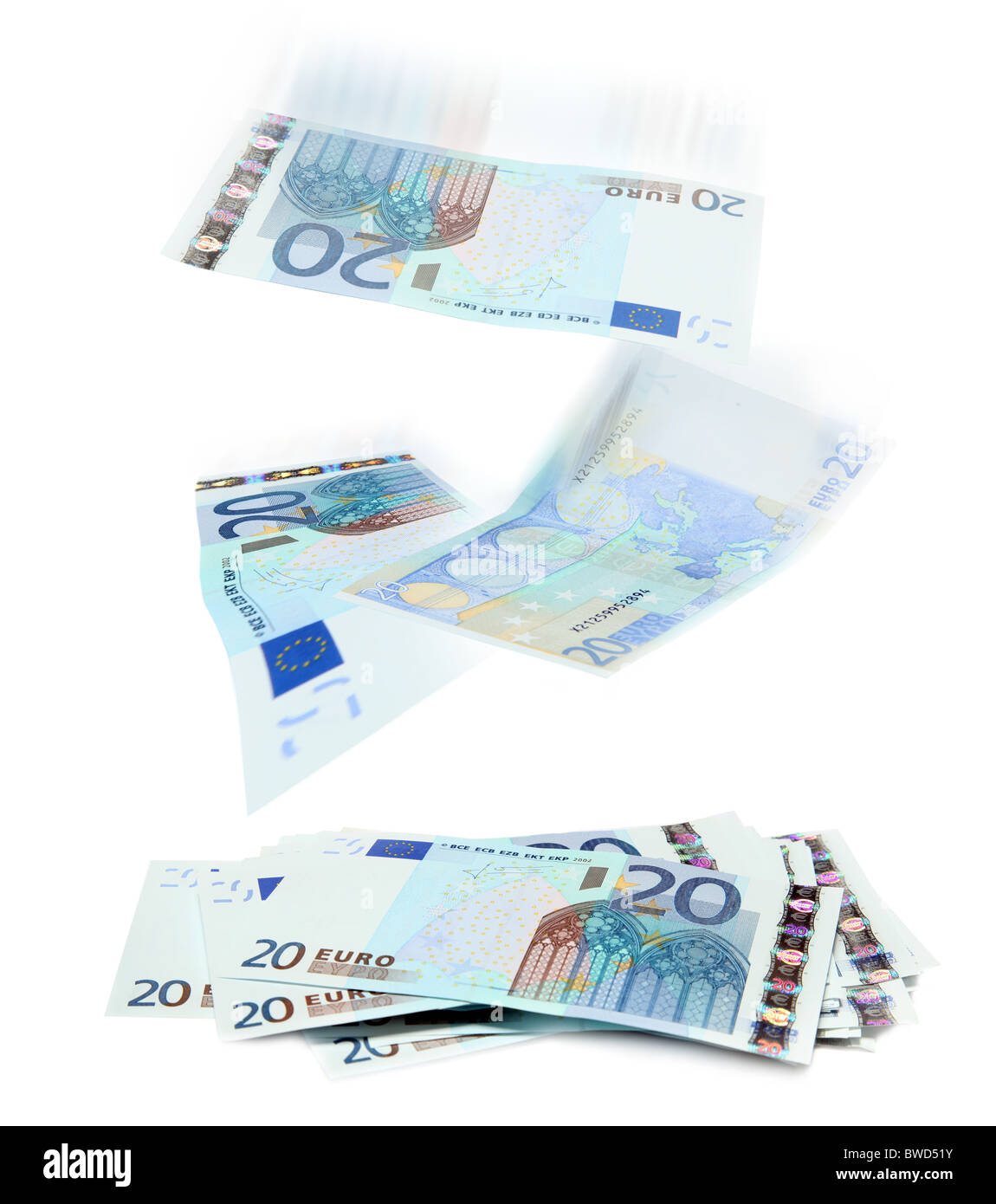 Euro notes falling towards a pile of €20s, cut out Stock Photo - Alamy
