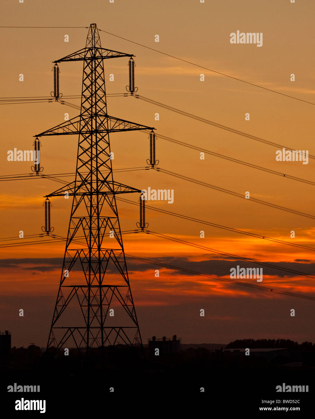Electric pylon at sunset Stock Photo - Alamy