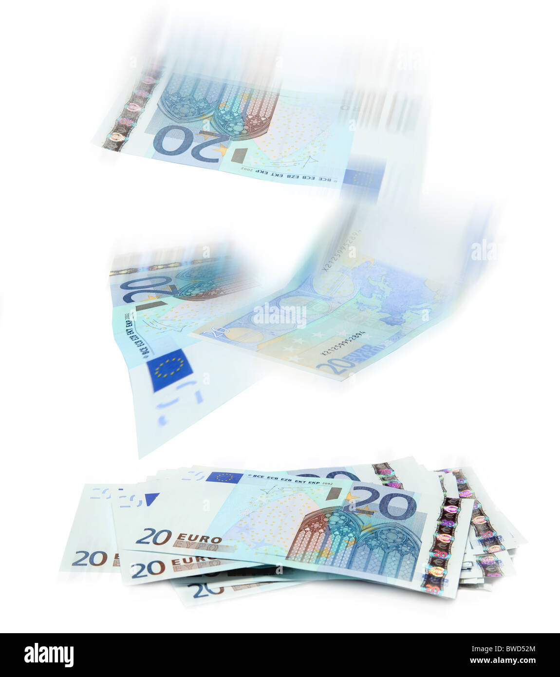 Euro notes falling towards a pile of €20s, cut out Stock Photo - Alamy