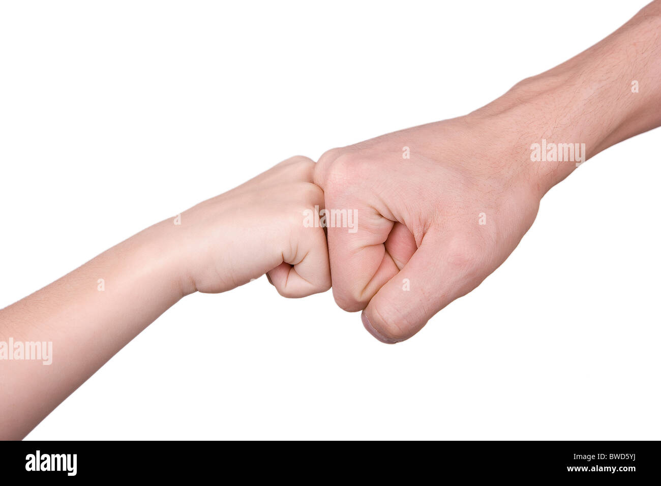 Two fists - children's and man's - on a white background Stock Photo ...