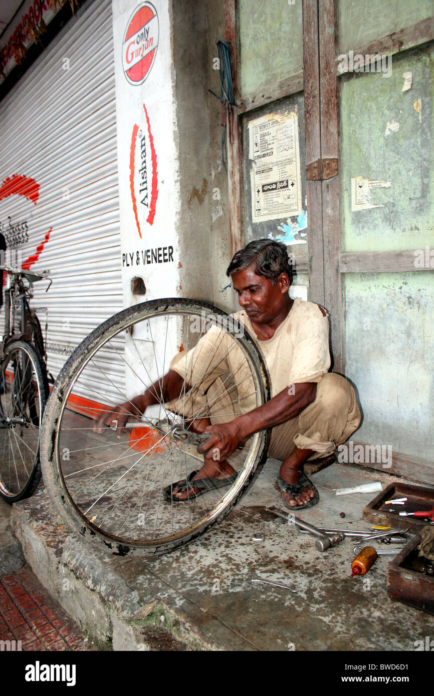 Indian man squatting in doorway hi-res stock photography and images - Alamy