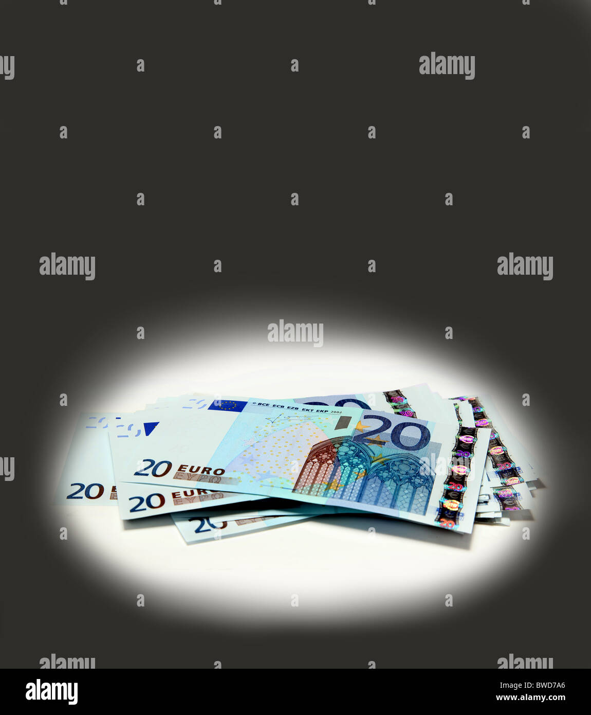 A pile of €20s in a spotlight, cut out Stock Photo - Alamy