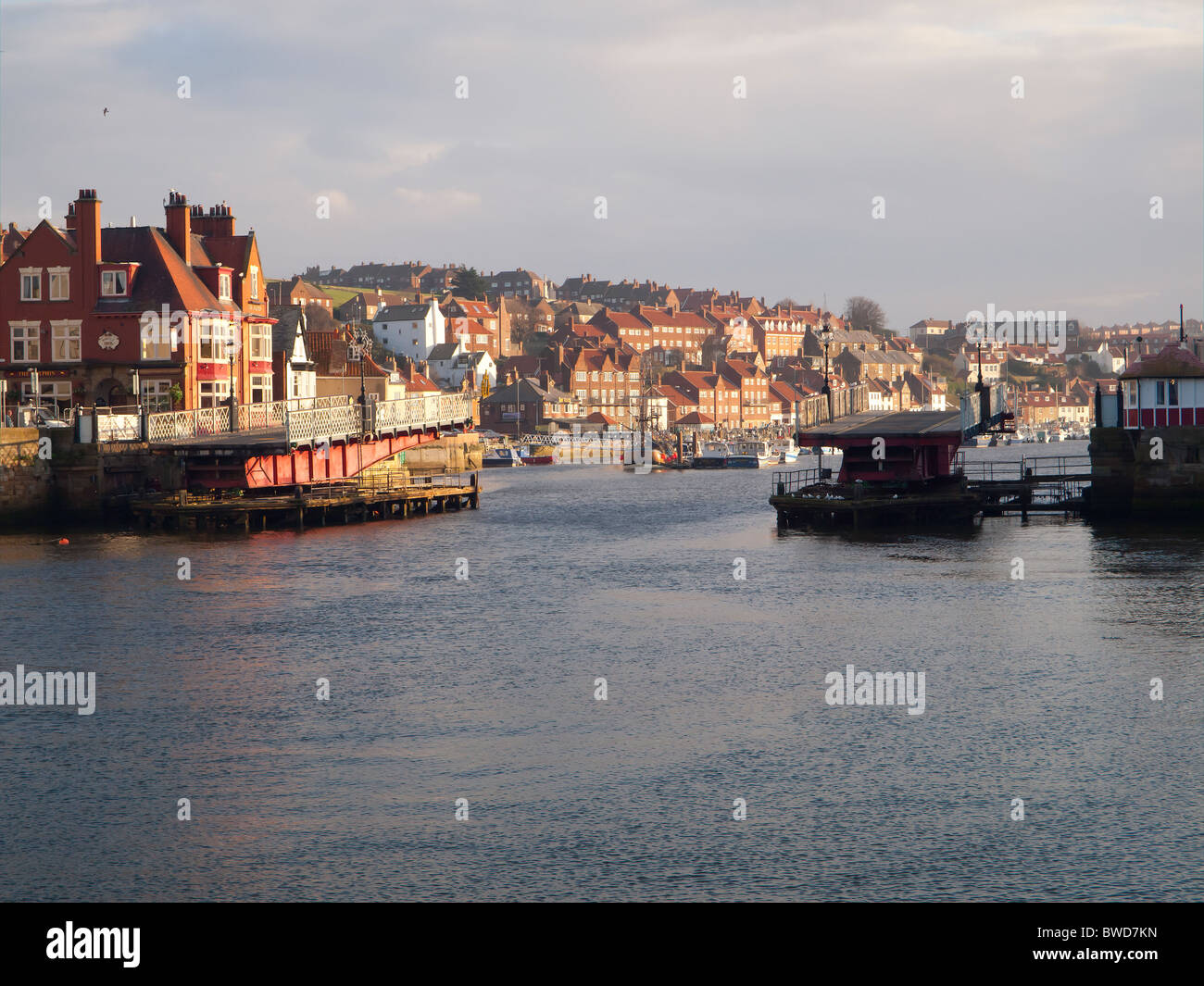 Whitby harbour with the swing bridge connecting east and west sides of ...