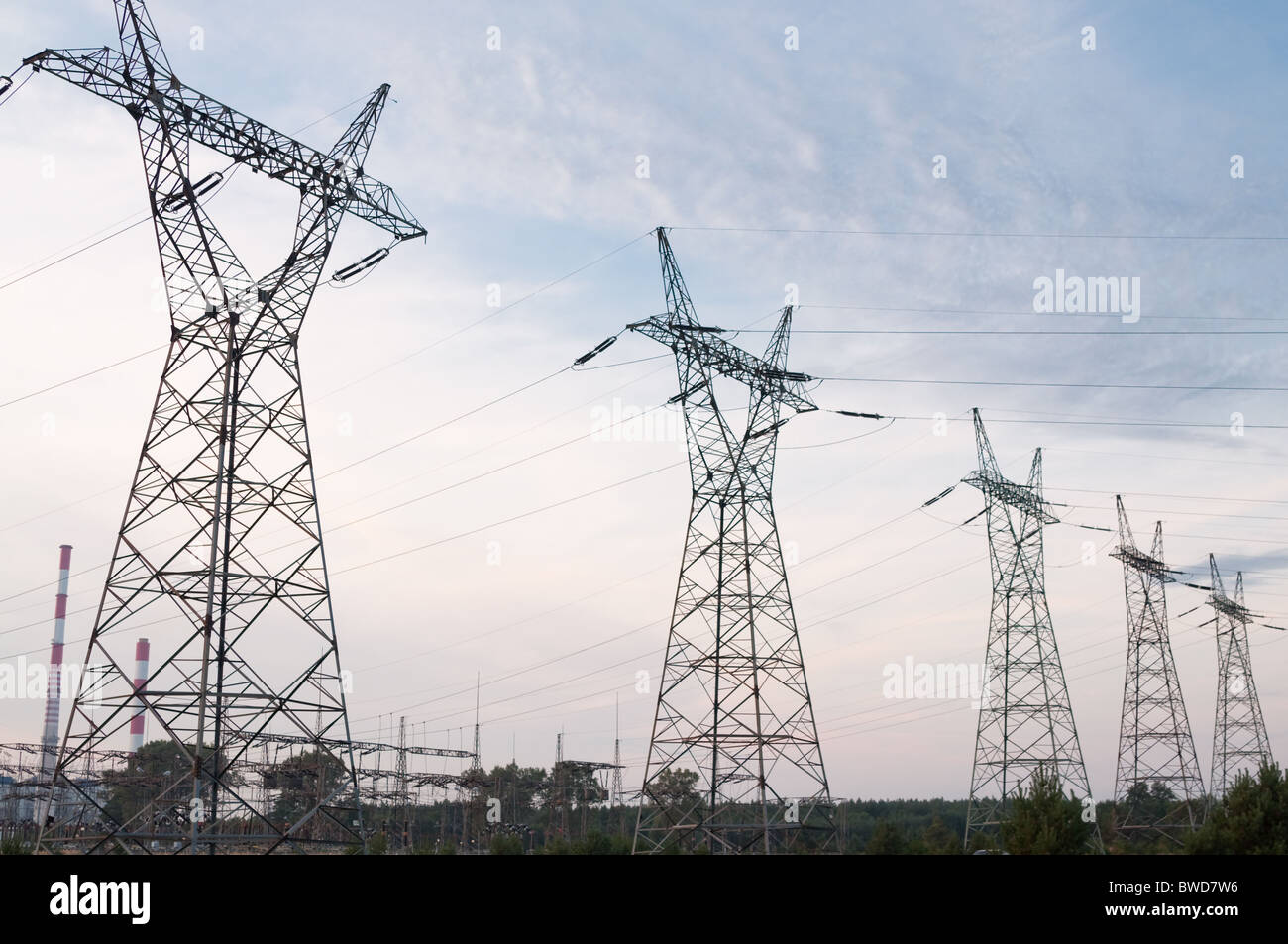 Transmission power line in sunset Stock Photo - Alamy