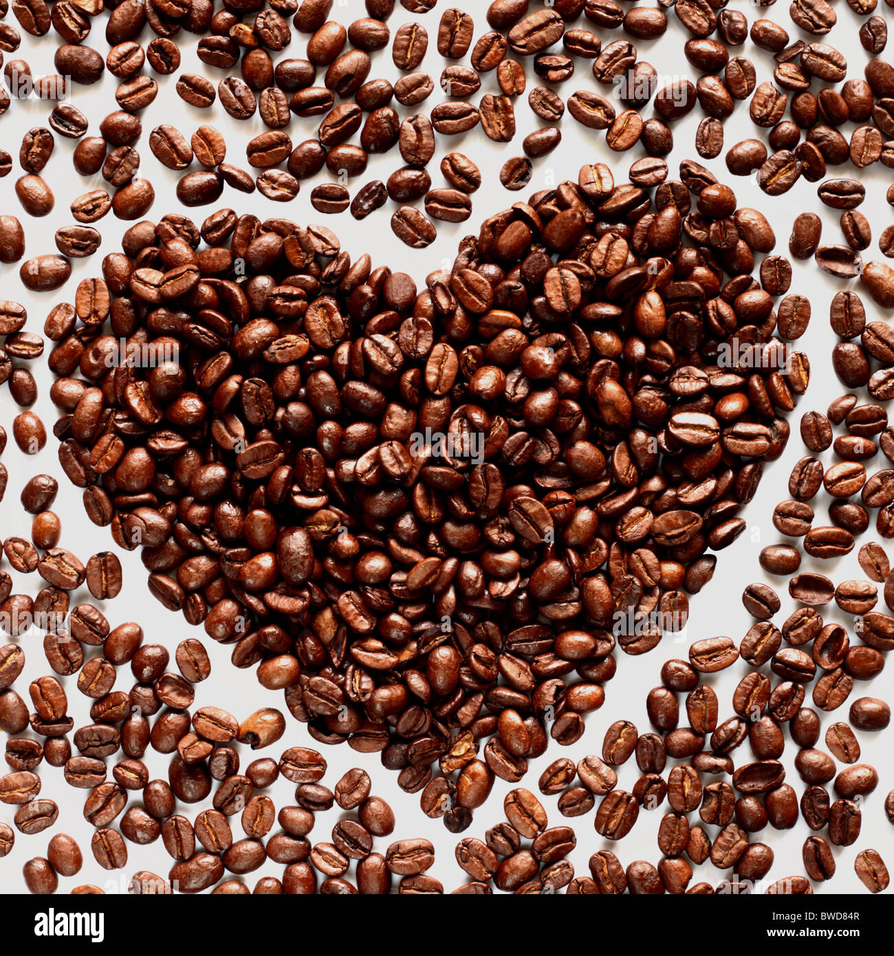 Heart shape symbol made from coffee beans Stock Photo - Alamy