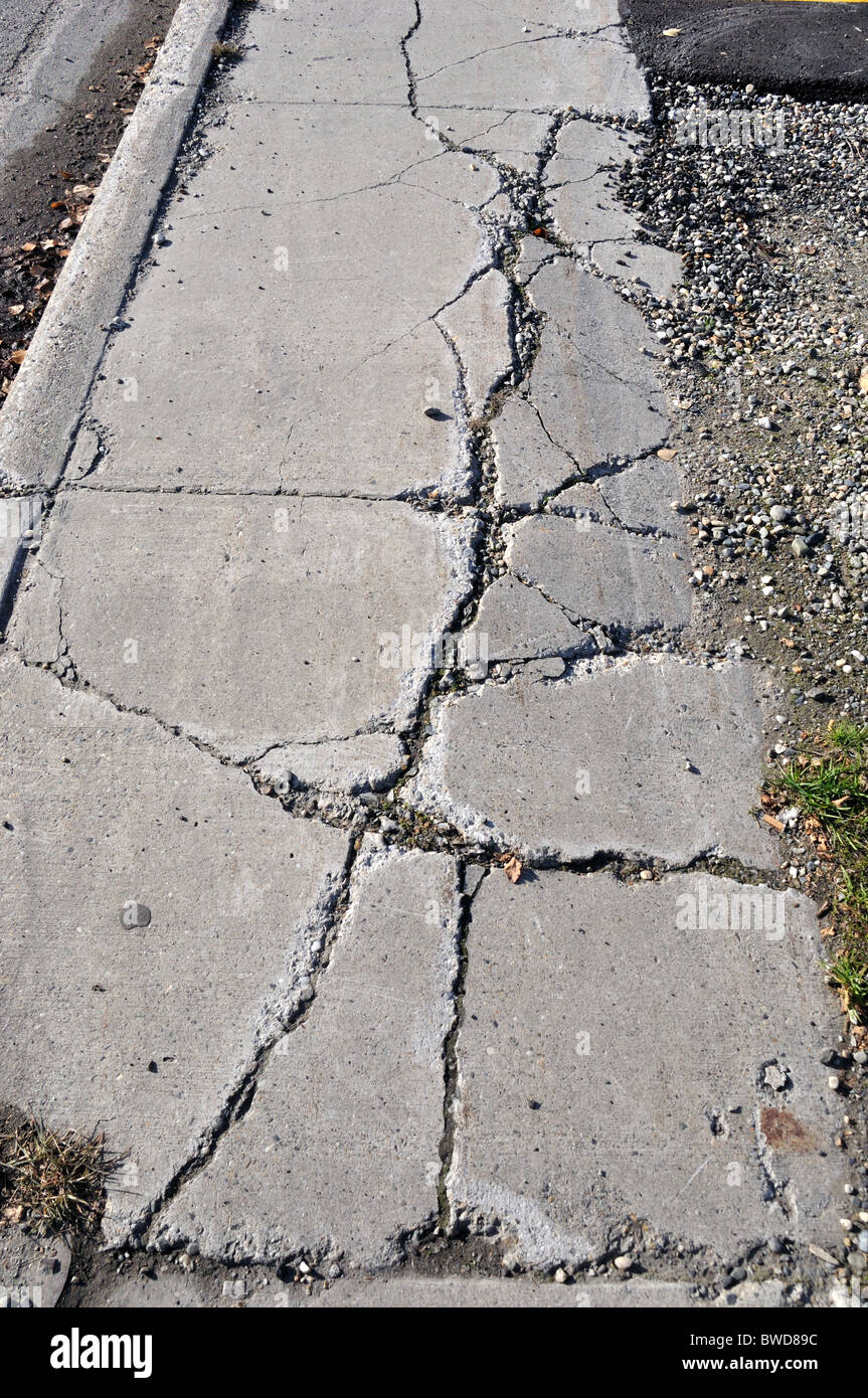 Cracked Sidewalk in Urban Area Stock Photo - Alamy