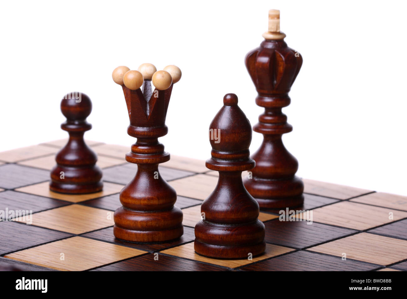 Wooden chess pieces on a chess board. Isolated on white, shallow DOF ...