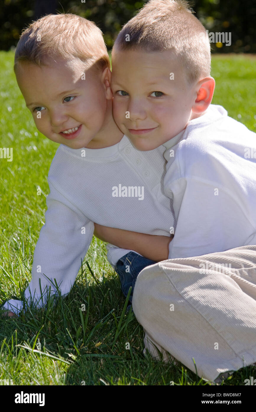 Two brothers hugging each other hi-res stock photography and images - Alamy
