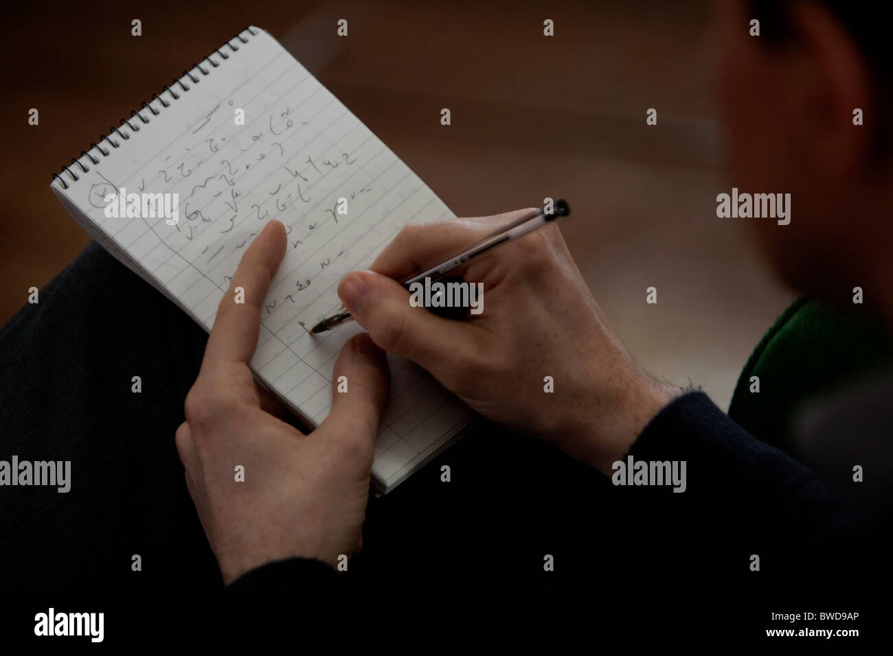 A reporter pictured writing in shorthand during an interview in London ...