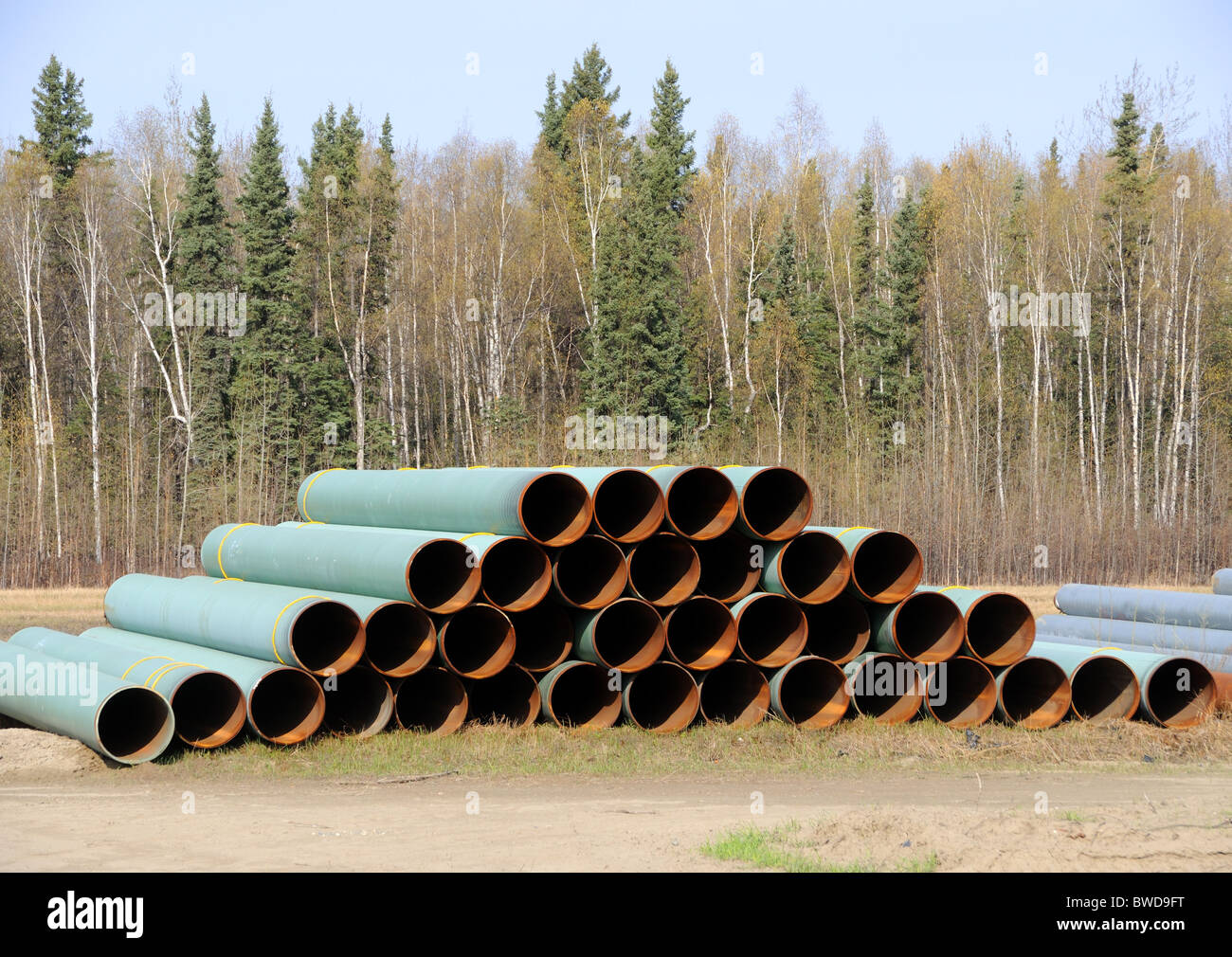 Stacked Pile of Pipe in an Industrial Yard Stock Photo - Alamy