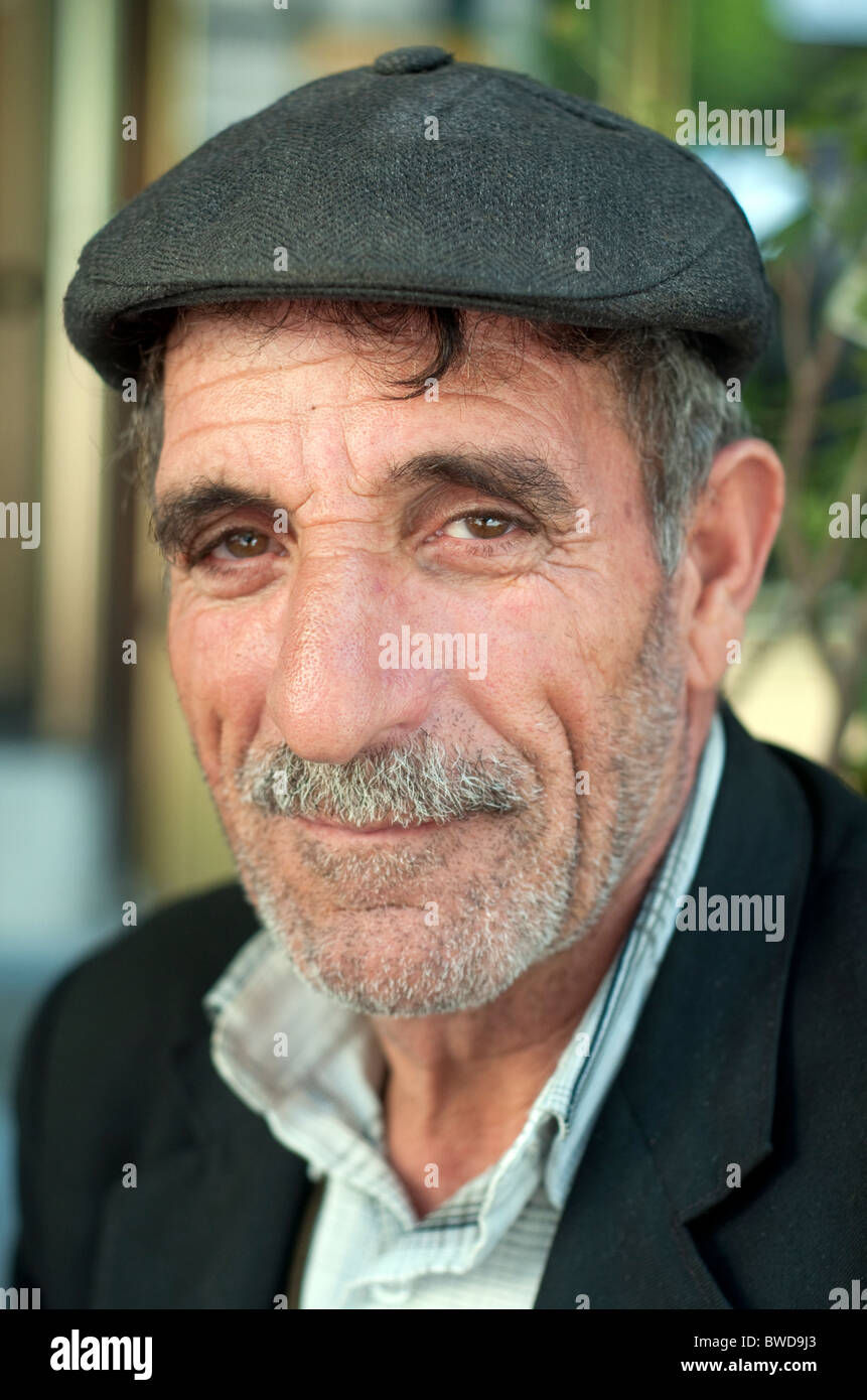 Portrait of a middle aged Kurdish man wearing a hat in the city of ...